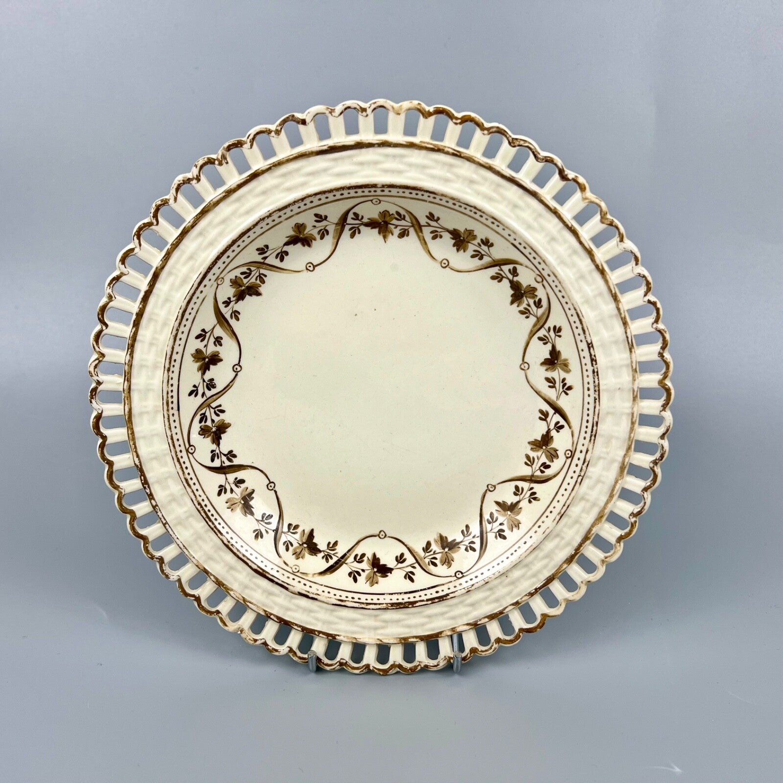A fine Turner arcaded creamware dish painted with a floral sepia patte ...